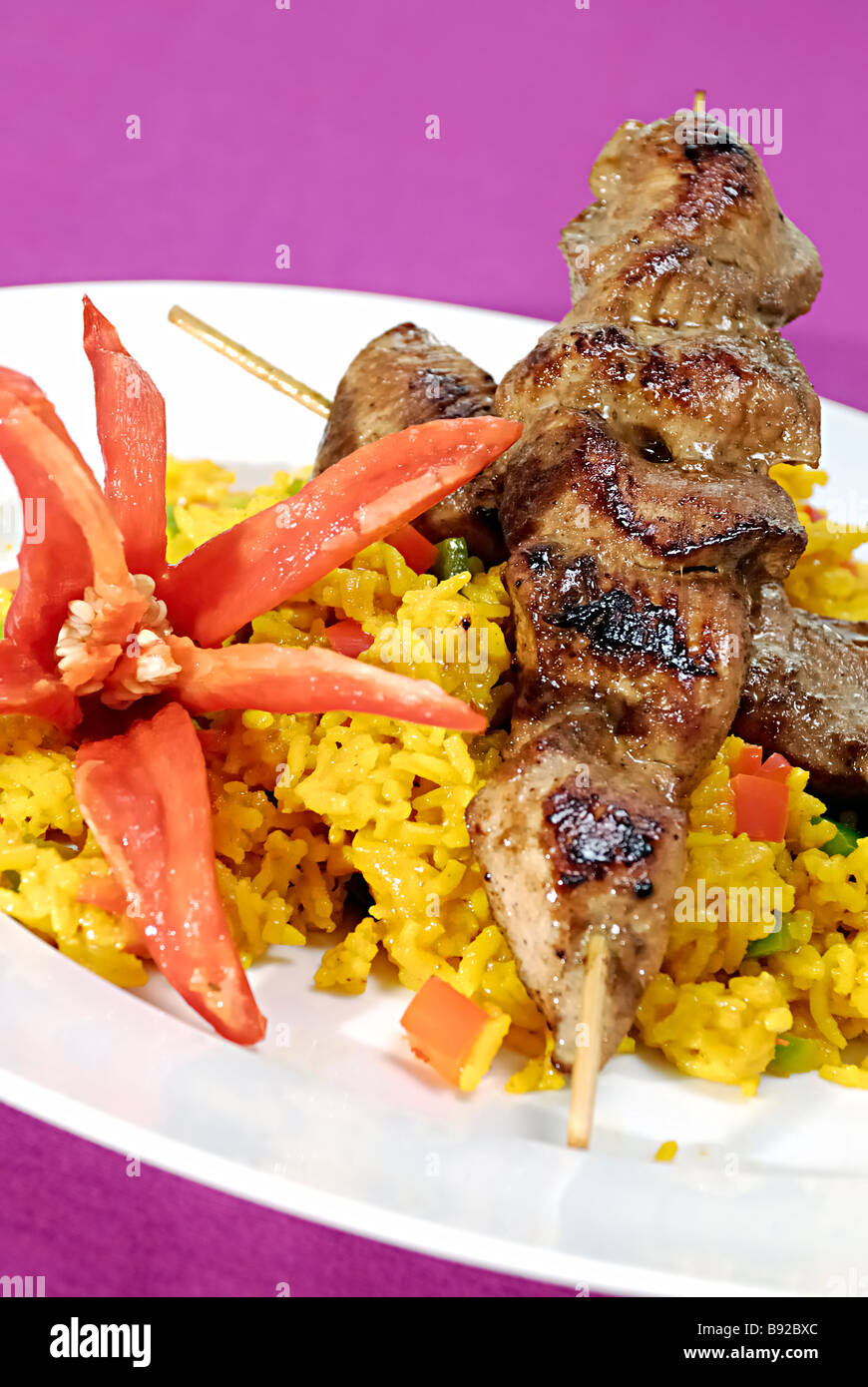 Satay chicken with curry rice Stock Photo - Alamy