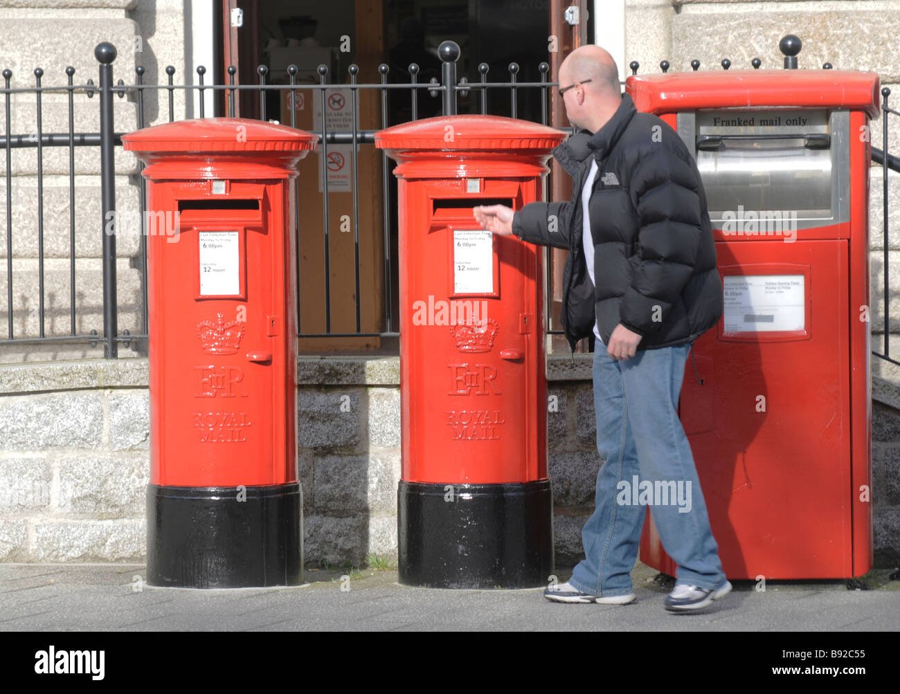 A man posting a letter in Falmouth, UK Stock Photo - Alamy