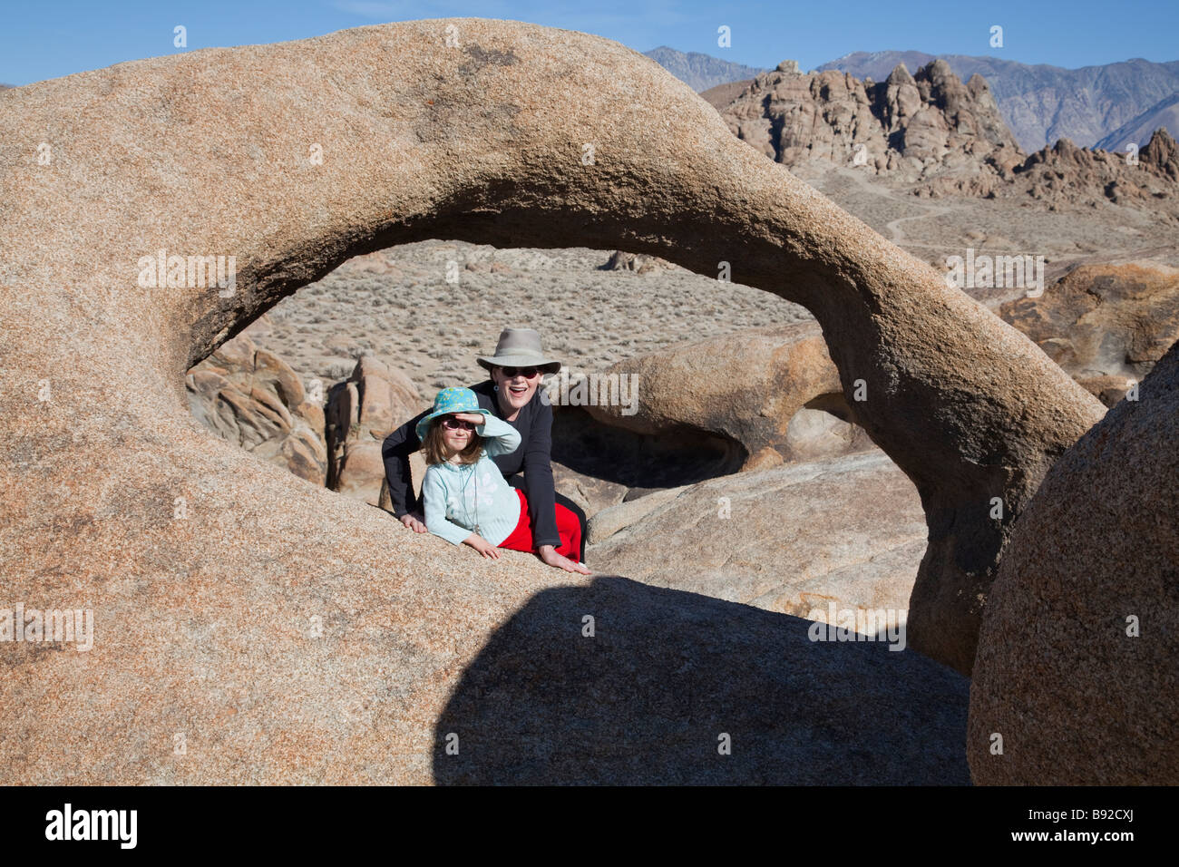 Girl sitting by natural arch hi-res stock photography and images - Alamy