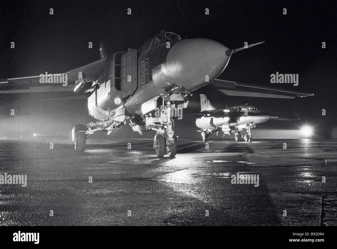 An echelon of MiG 23 Flogger fighters gearing up for a night training ...