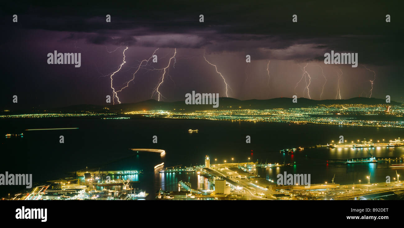 Lightning and dark storm clouds over the night lights of Cape Town ...
