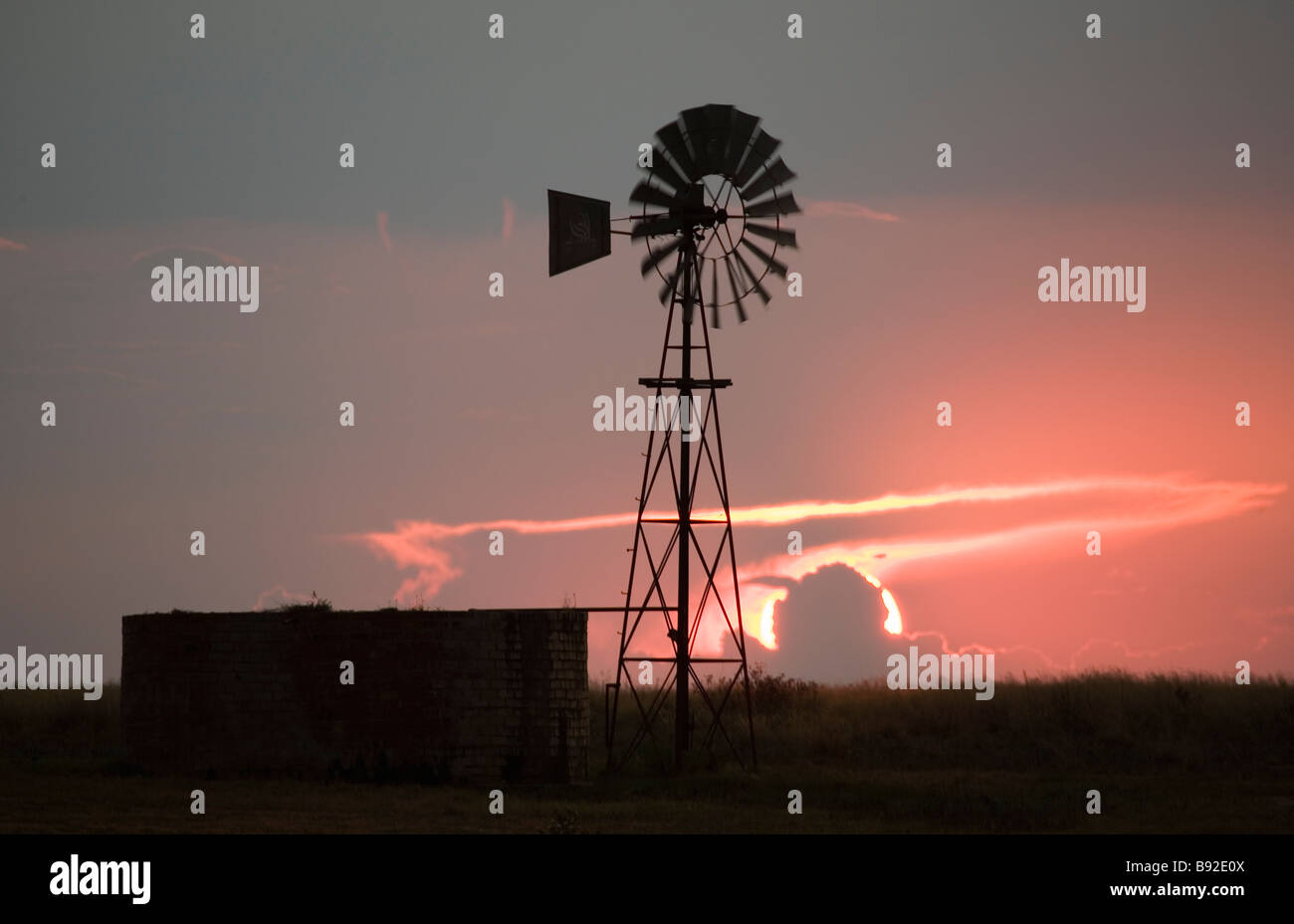 Dramatic windmill sunset on a Free State Province Farm in South Africa ...