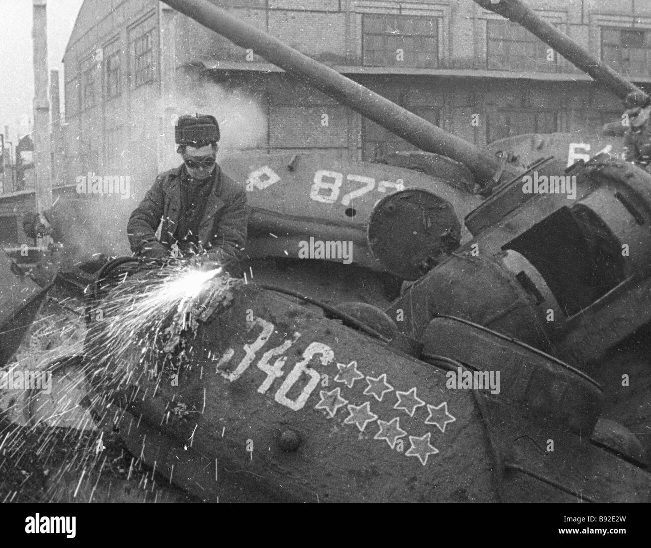 A gas welder cutting tank armor for remelting Stock Photo - Alamy