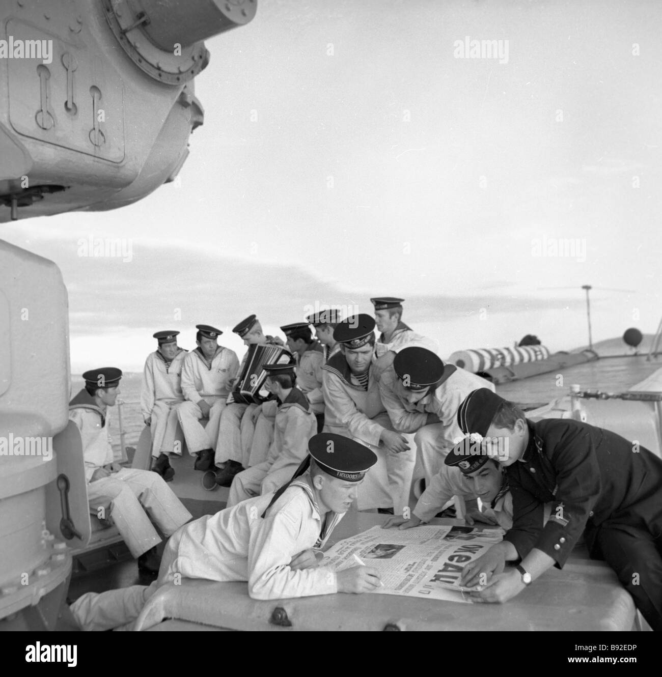 Sailors preparing a wall newspaper during intervals between exercises ...