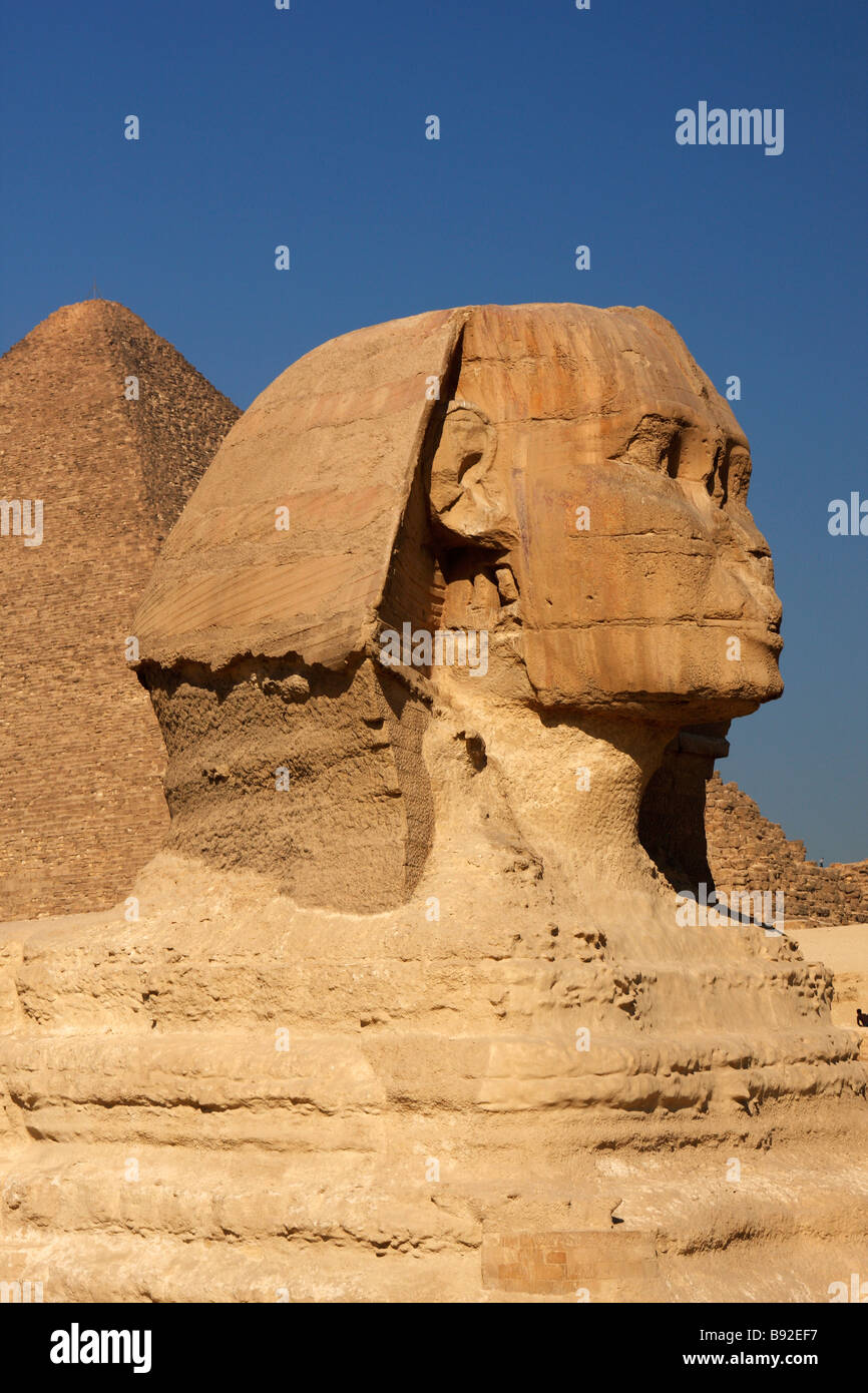 Carved stone head of the Sphinx, "close up" profile, and Great Pyramid ...
