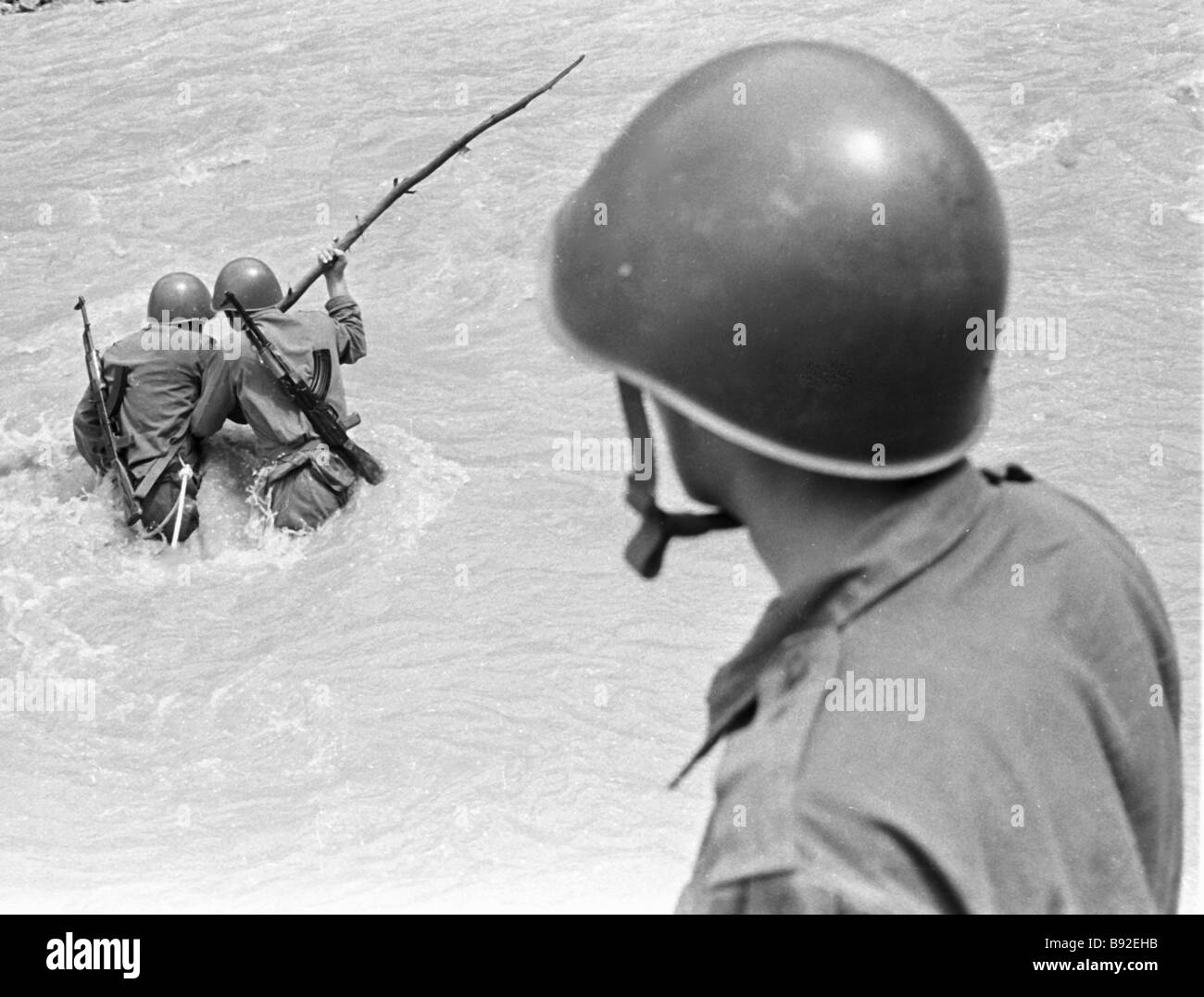 Soldiers force a mountain river crossing Stock Photo - Alamy