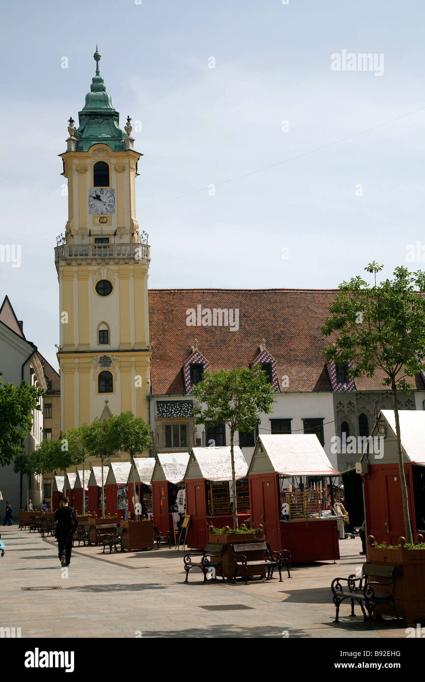 Local merchants in their small wooden stalls offer their wares for sale ...