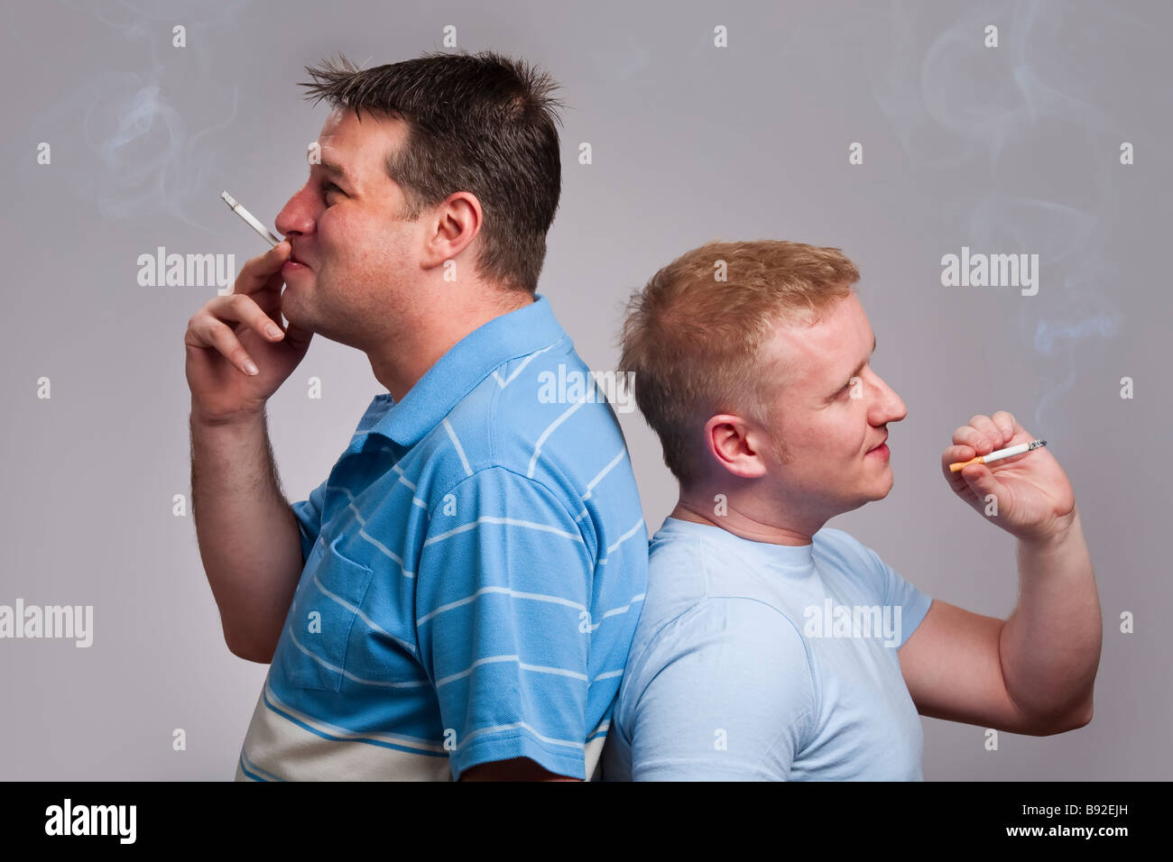 Men smoking cigarettes hi-res stock photography and images - Alamy