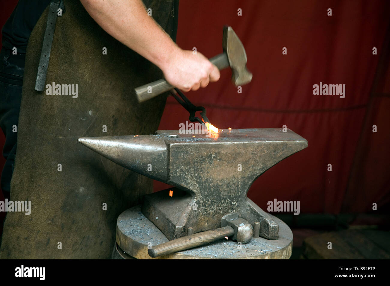 Blacksmith working in a traditional setting in Prague Castle Prazsky ...
