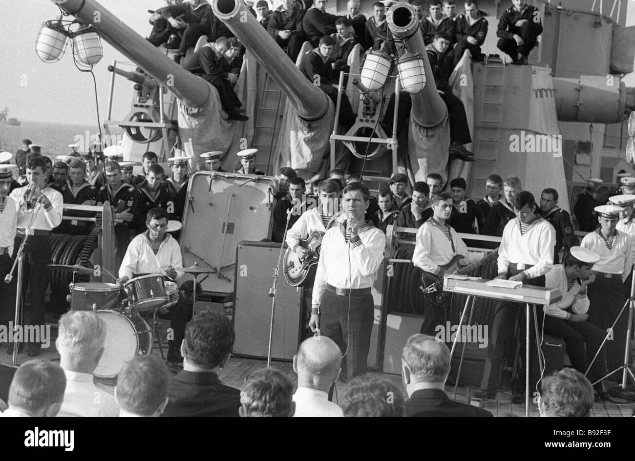 Sailors members of music group performing aboard warship Stock Photo ...