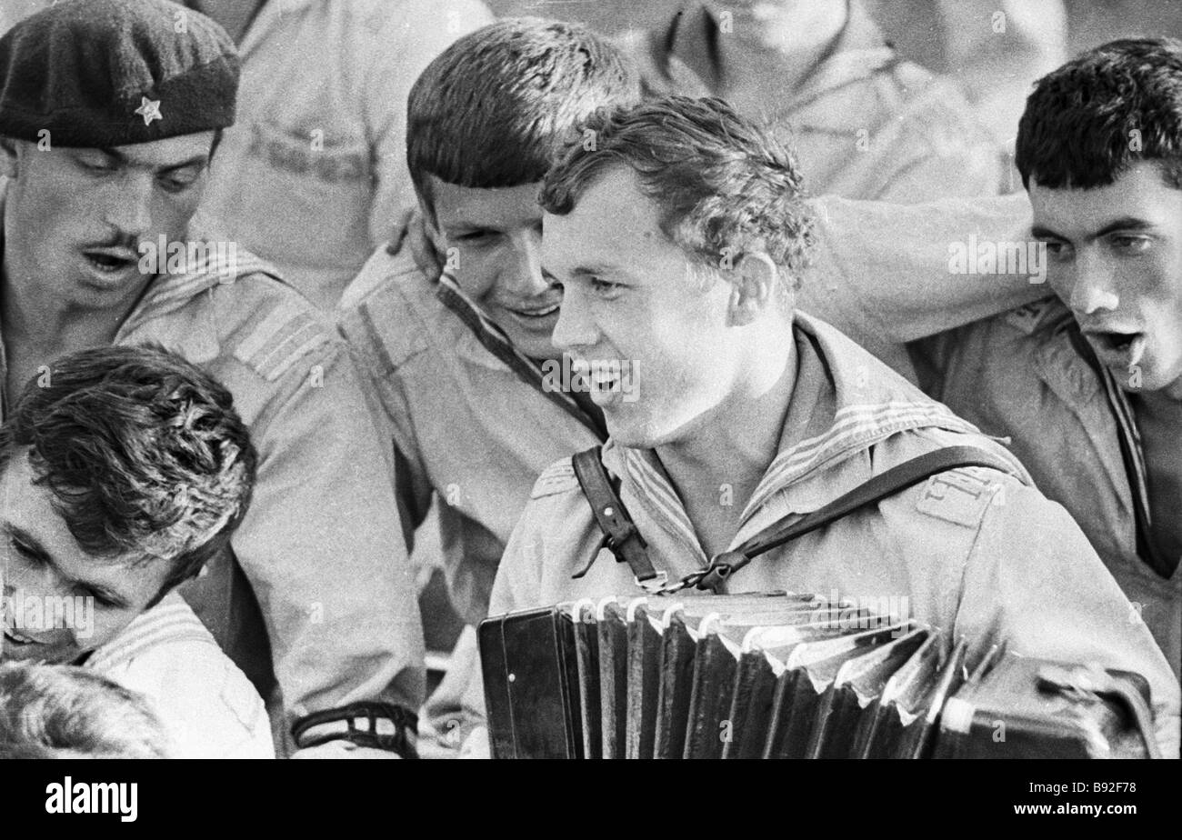 Seamen playing accordion Stock Photo - Alamy