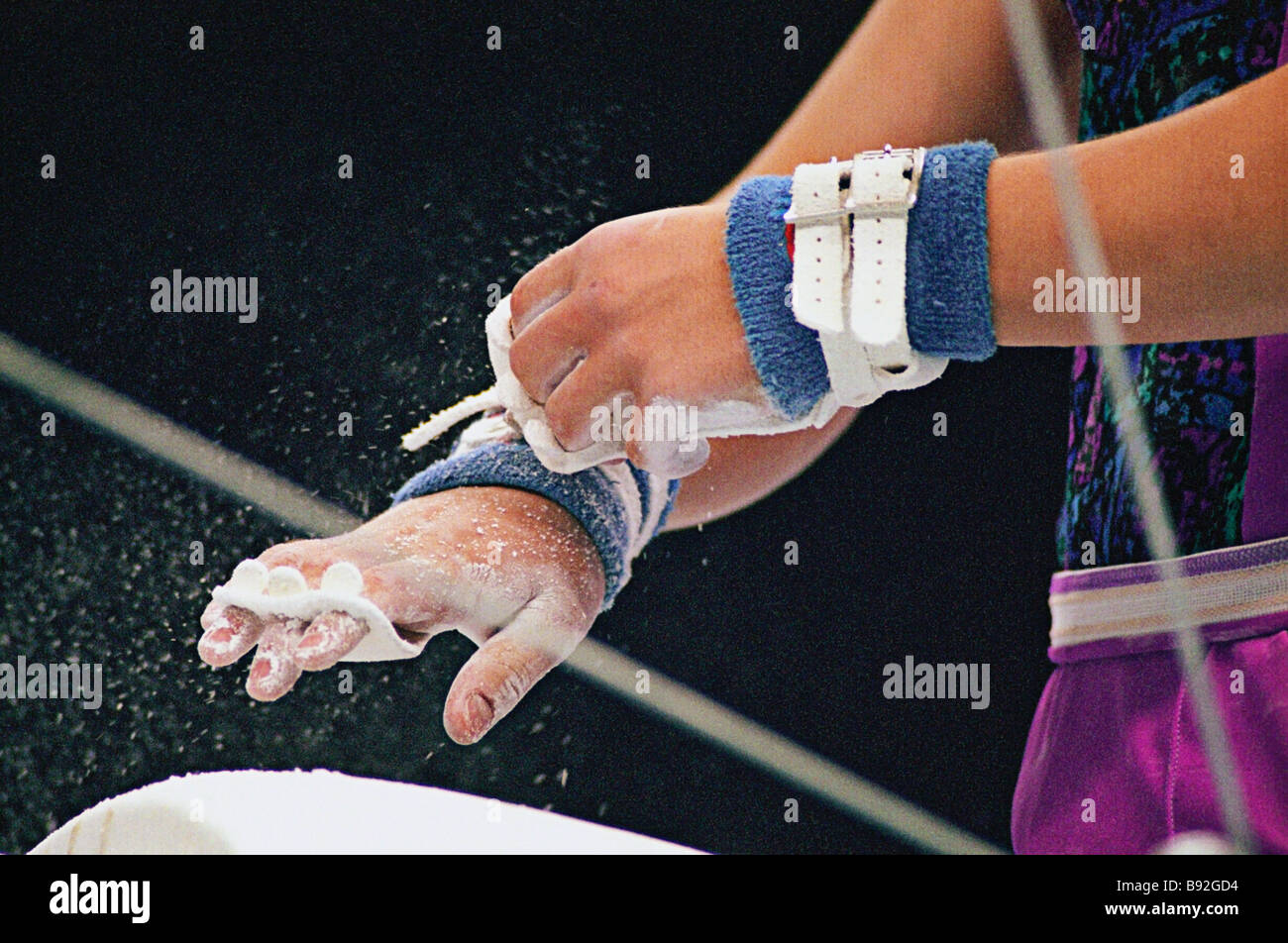 An athlete getting ready to competitions on artistic gymnastic ...