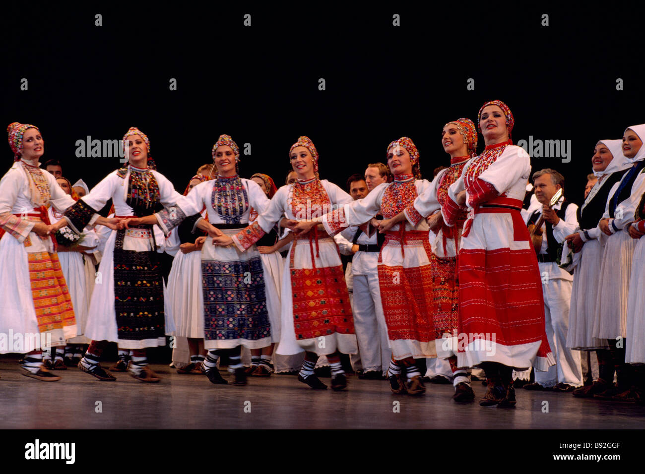 Croatian Folk Dance Group performing on Stage in Traditional Costume ...