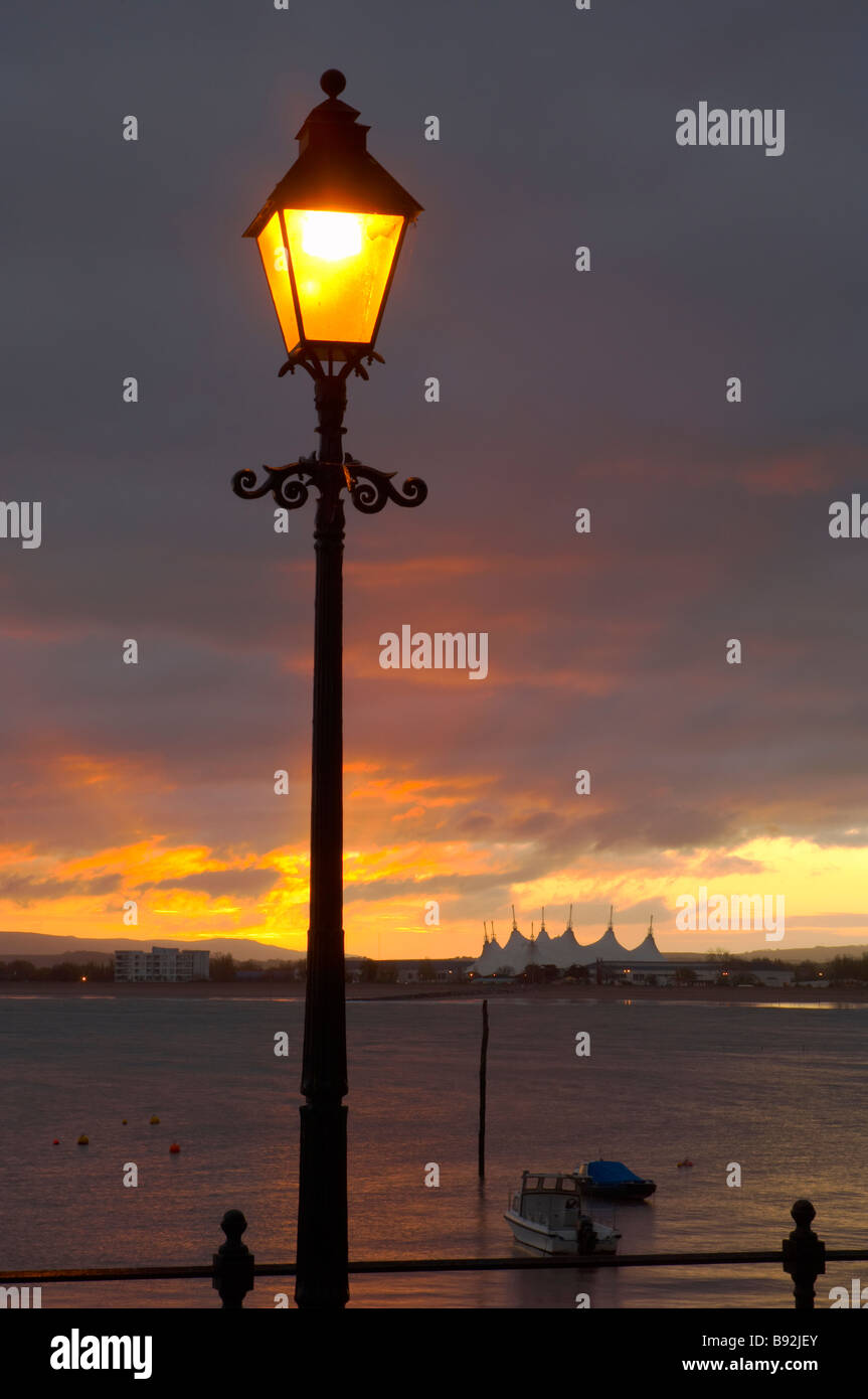 Minehead harbour and views toward Butlins holiday camp at dawn under a ...