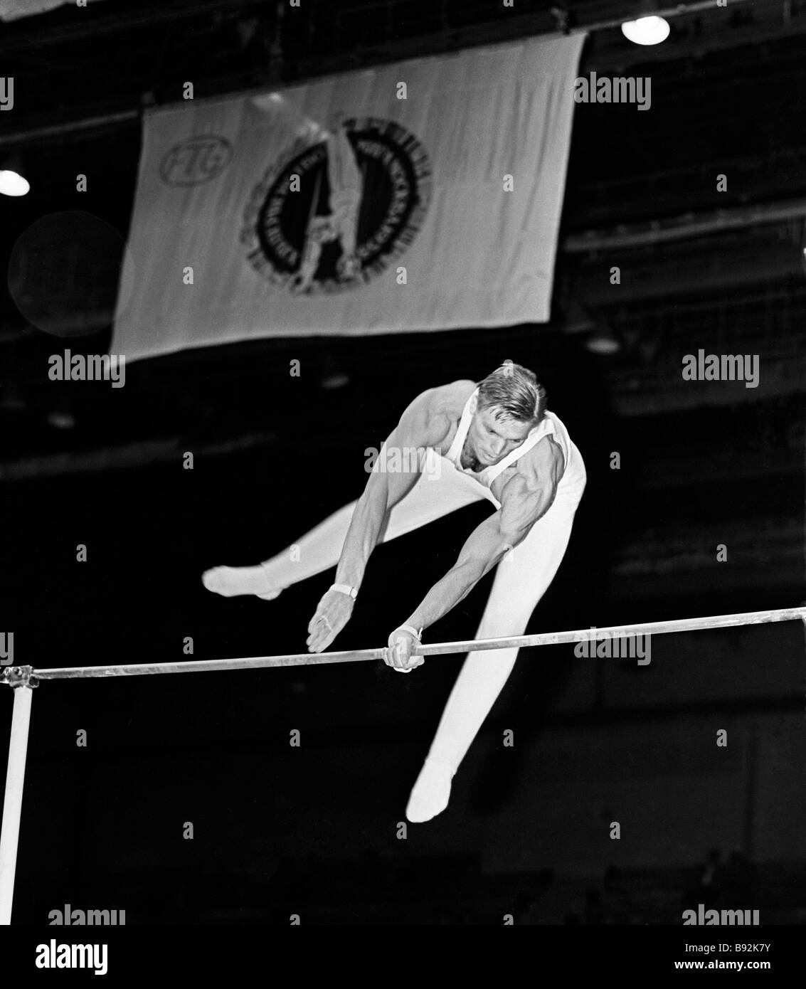 Soviet gymnast Boris Shakhlin performing on the bar during the 1958 ...