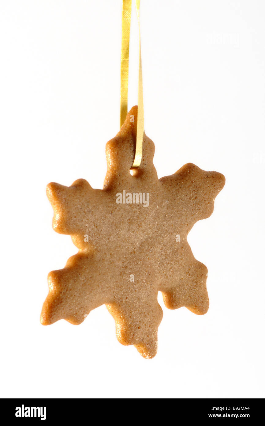 Hanging ginger cookie on a white background Stock Photo - Alamy