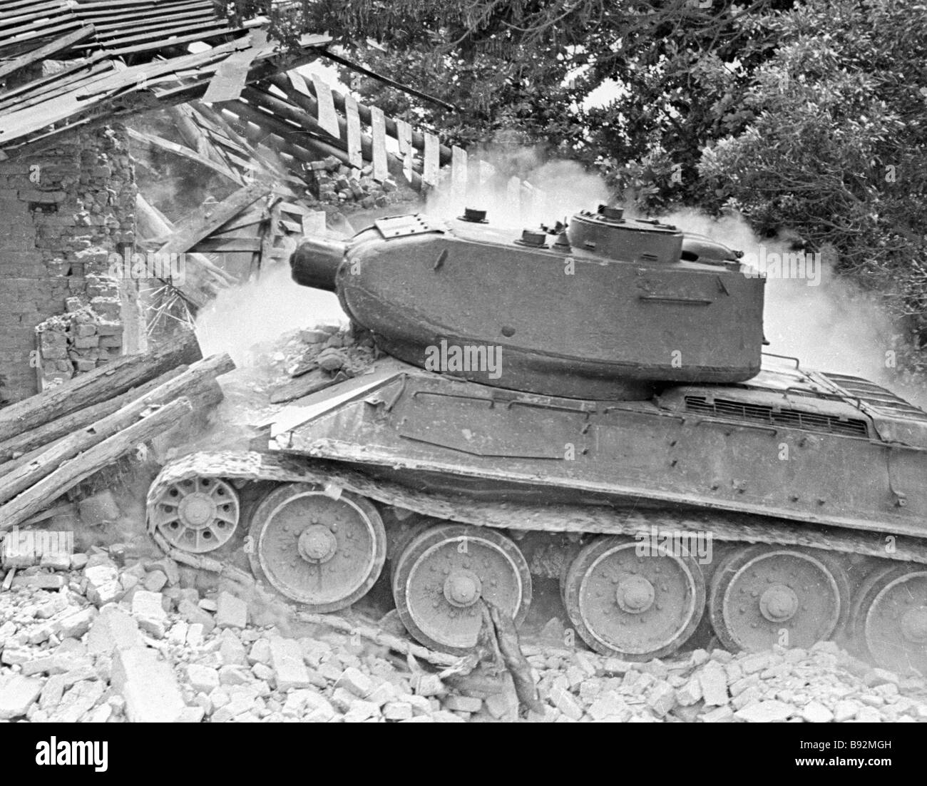 A T 34 tank clearing up the rubble in the wake of a Tashkent earthquake ...