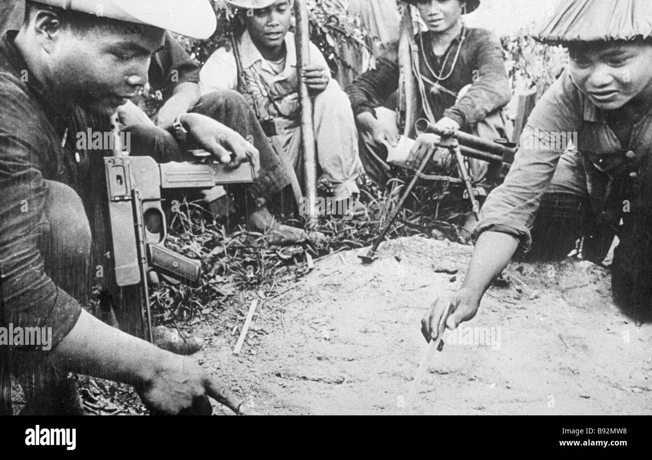 Soldiers of the South Vietnam Liberation Army developing a plan of a ...