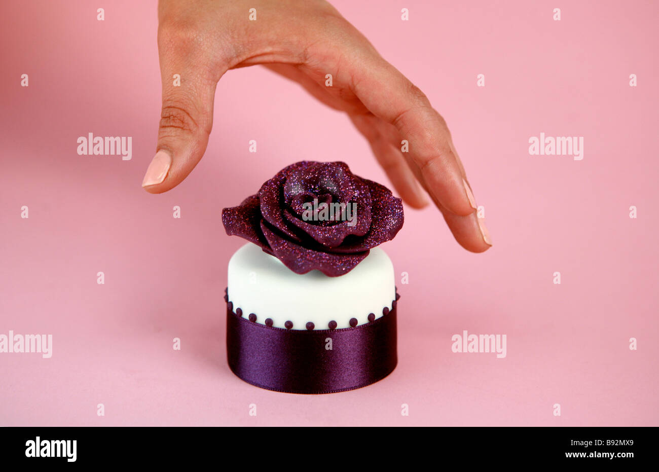 Hand reaching cake hi-res stock photography and images - Alamy