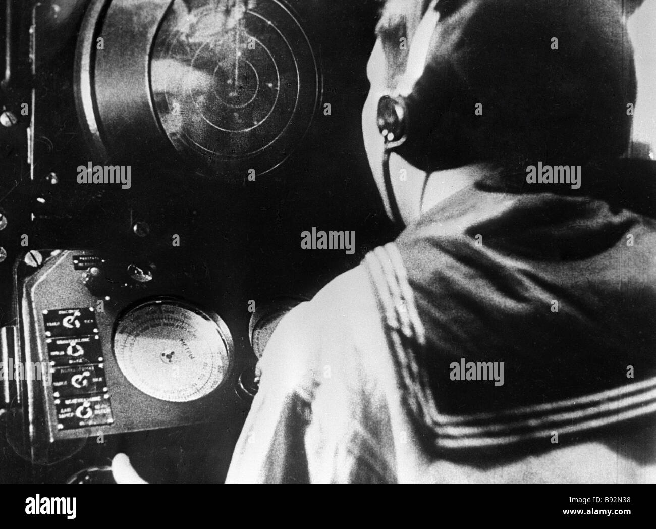 Sailor watches approaching objects on radar Stock Photo - Alamy