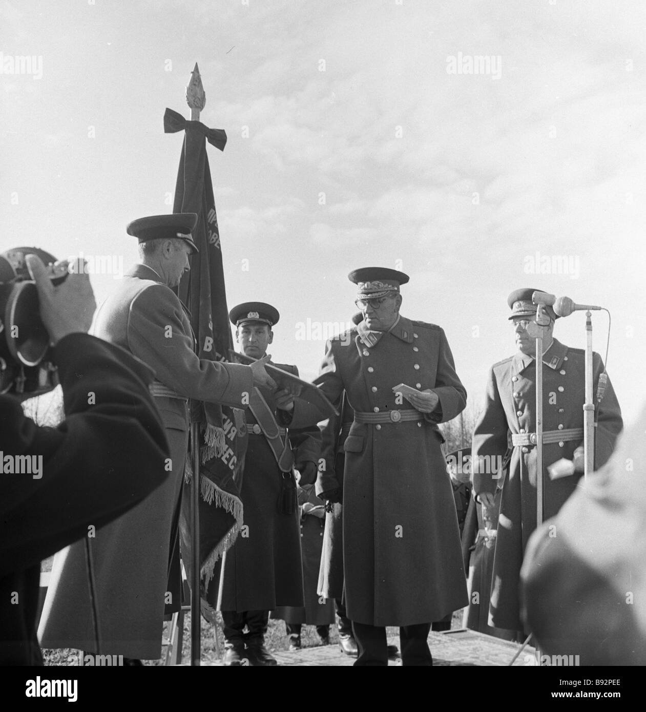 USSR Defense Minister Marshal Andrei Grechko hands the Memorial banner ...