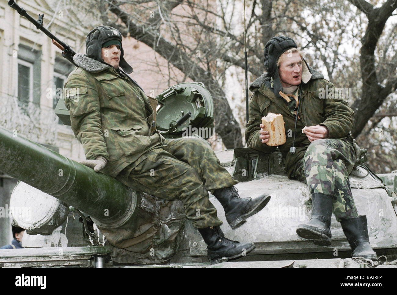 Soldiers of the Russian Army having a rest on a tank in the streets of ...