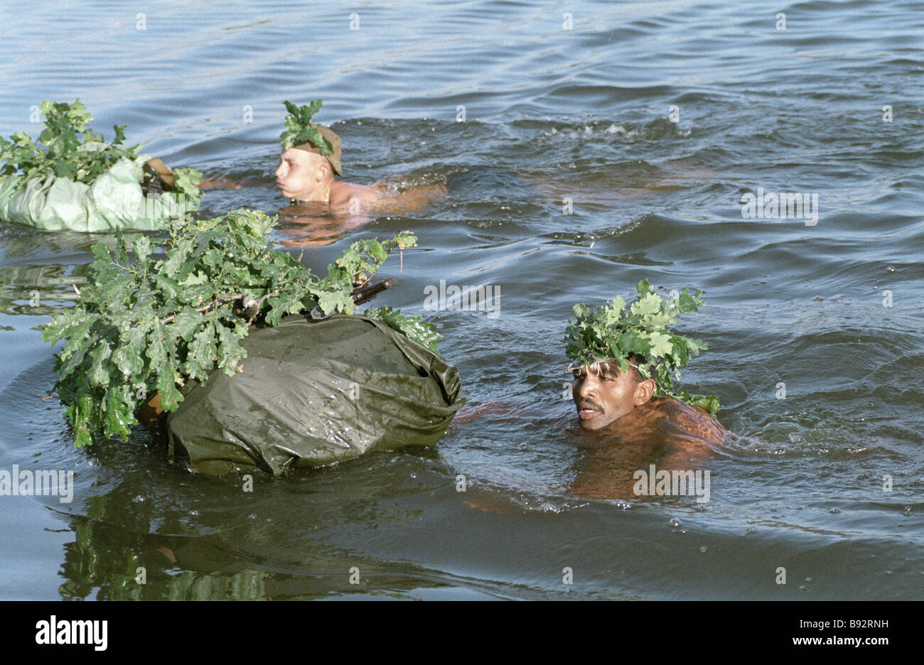 A Russian special force trooper and Jordanian ranger force a water ...