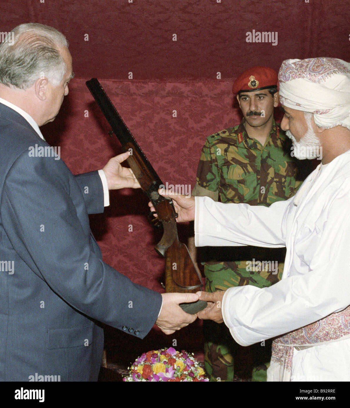 Russian Prime Minister Viktor Chernomyrdin left making a gift of a ...