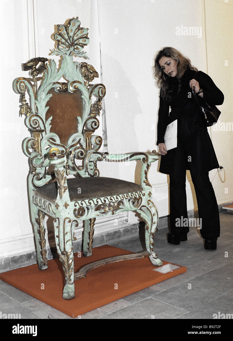 A girl visitor admires a bishop s ceremonial chair of the 1750s at the ...