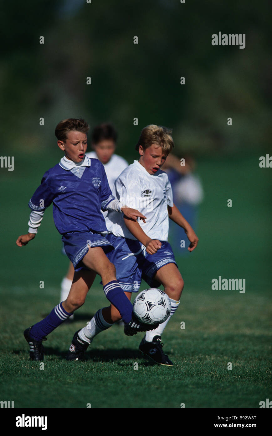 11 year old boys soccer action Stock Photo - Alamy