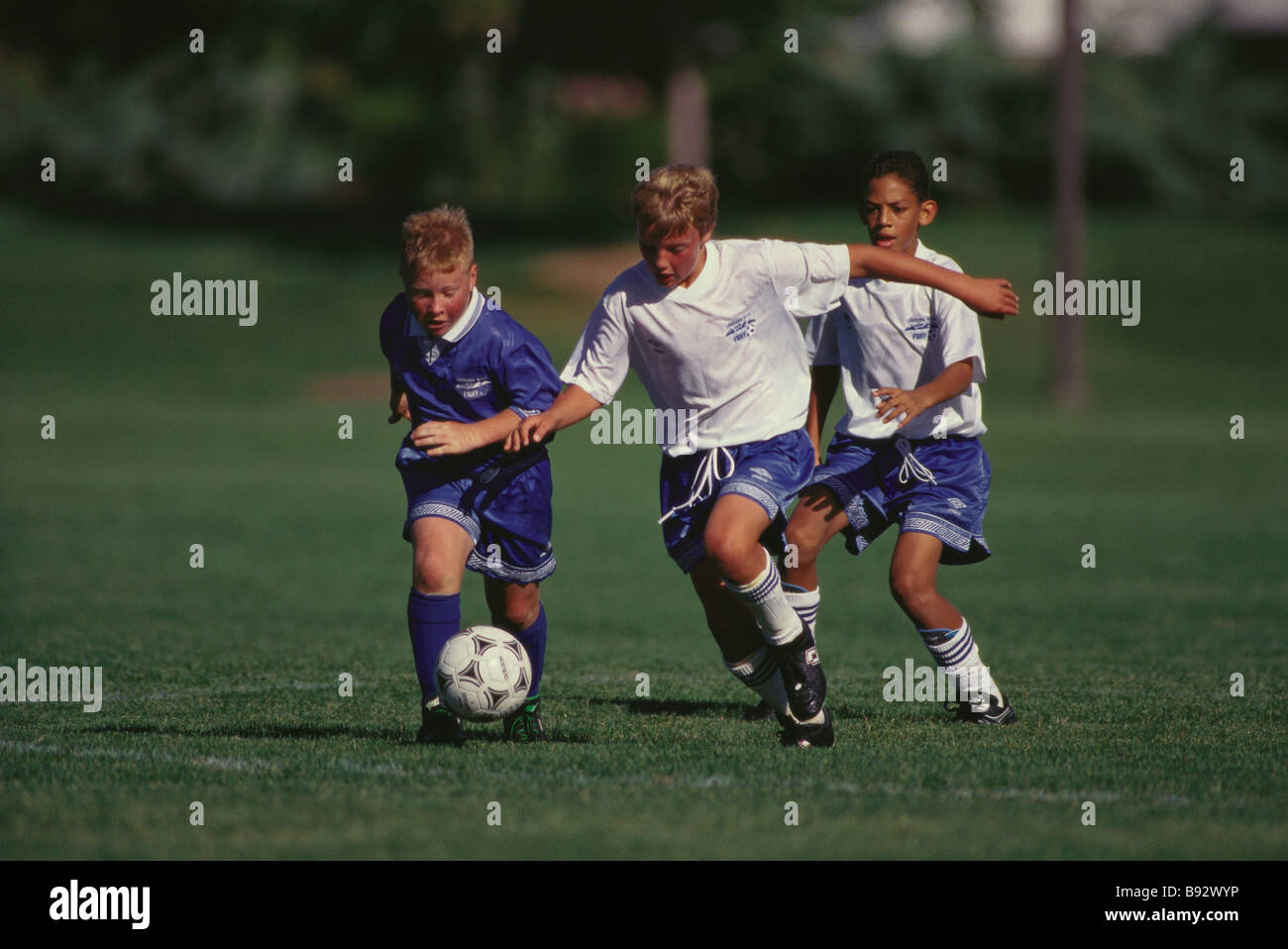 11 year old boys soccer action Stock Photo - Alamy