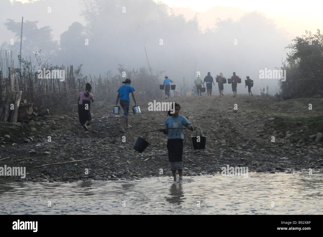 Women collect water Stock Photo - Alamy