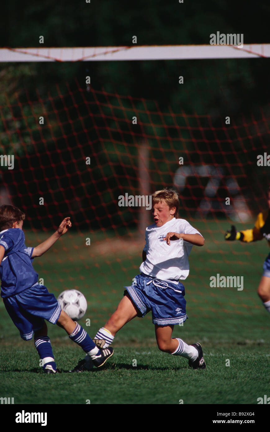11 year old boys soccer action Stock Photo - Alamy