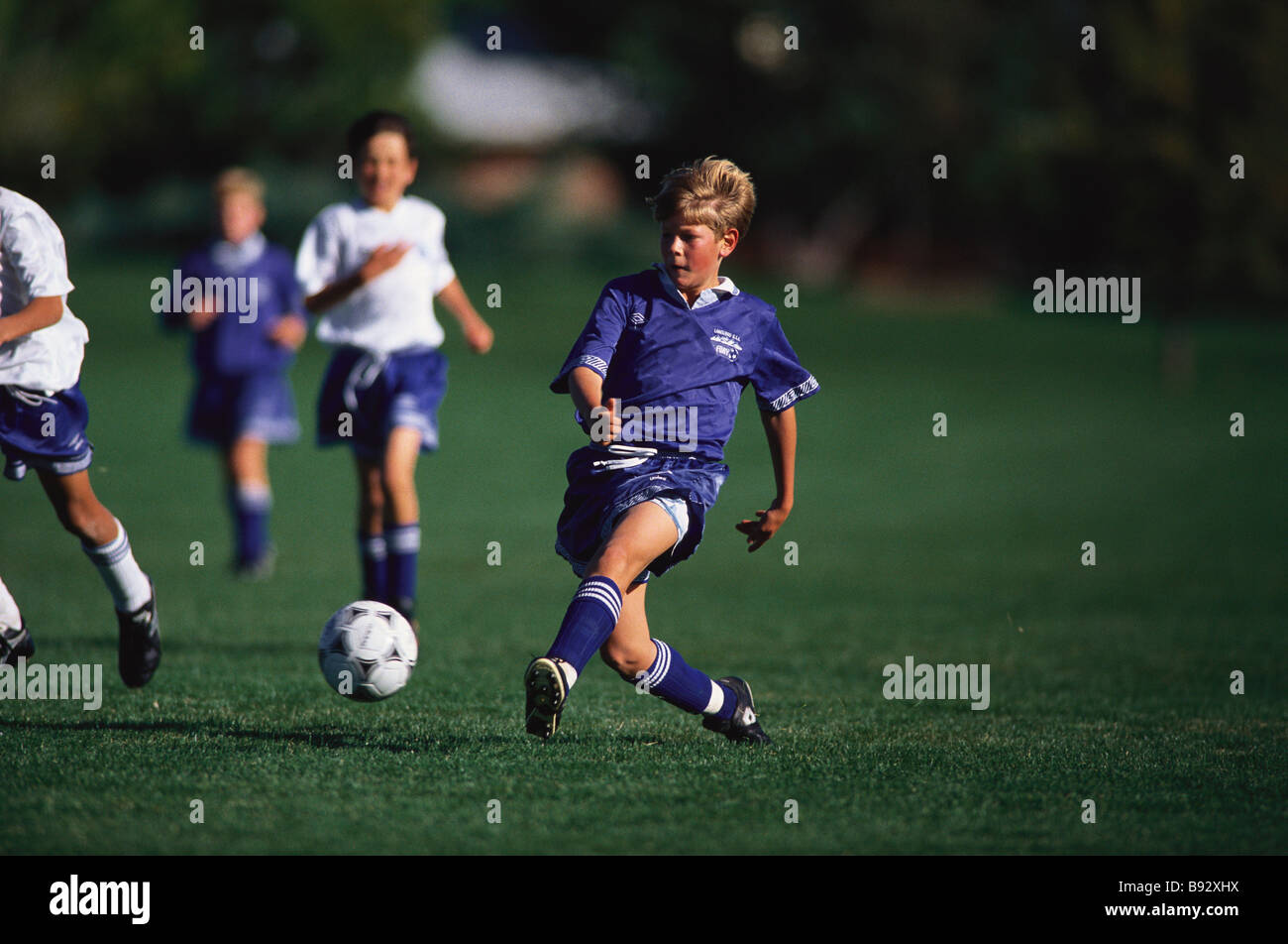 11 year old boys soccer action Stock Photo - Alamy