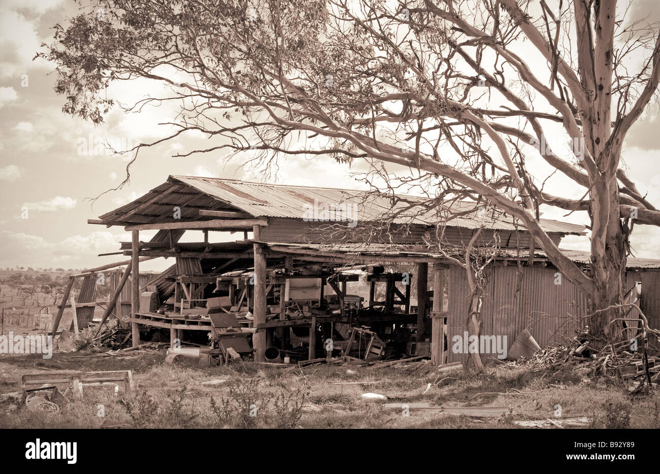 great red sepia image of an old farm shed building Stock Photo - Alamy