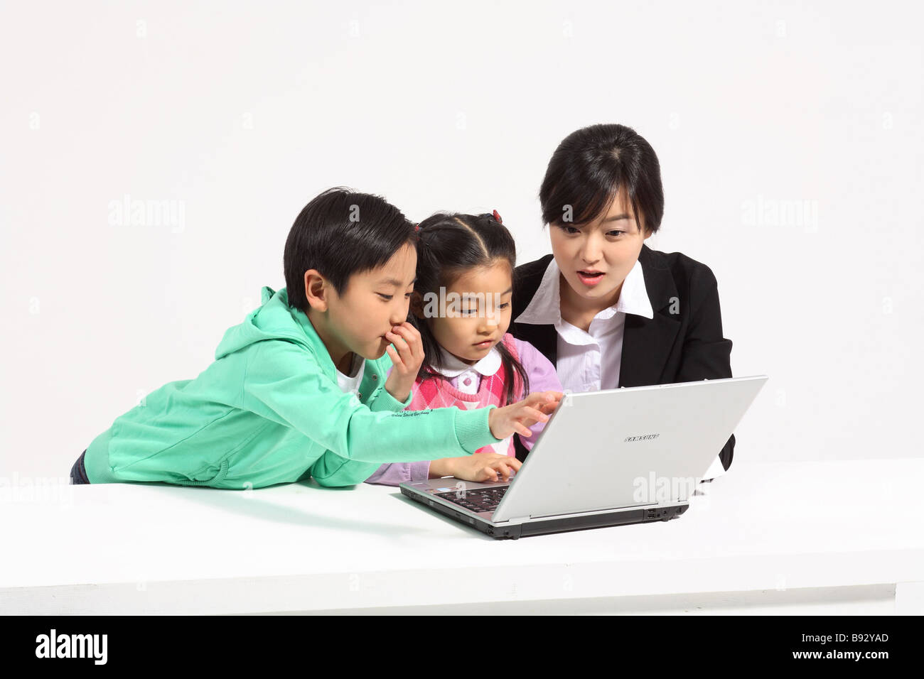 Child and Teacher in Study Stock Photo - Alamy