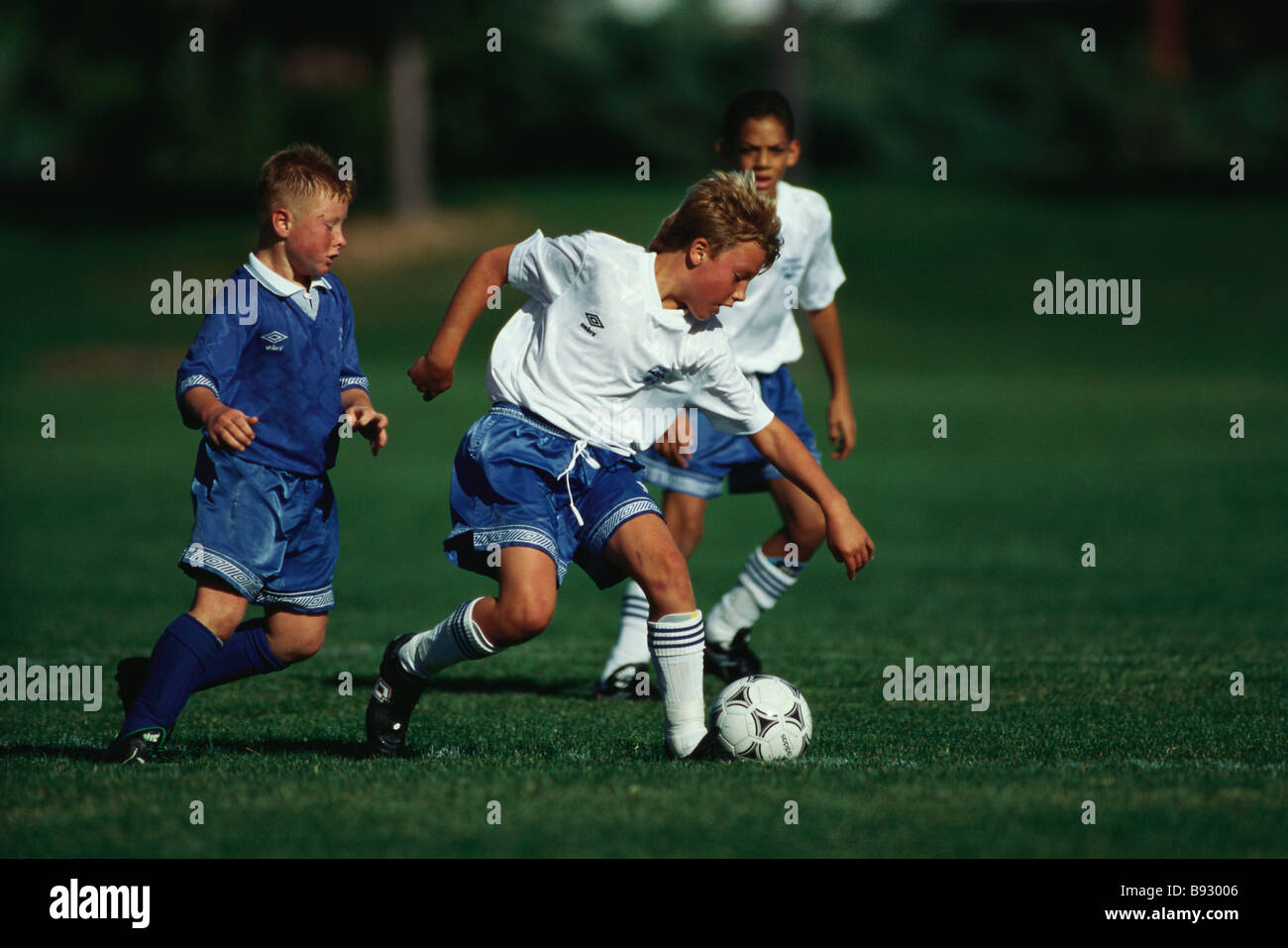11 year old boys soccer action Stock Photo - Alamy