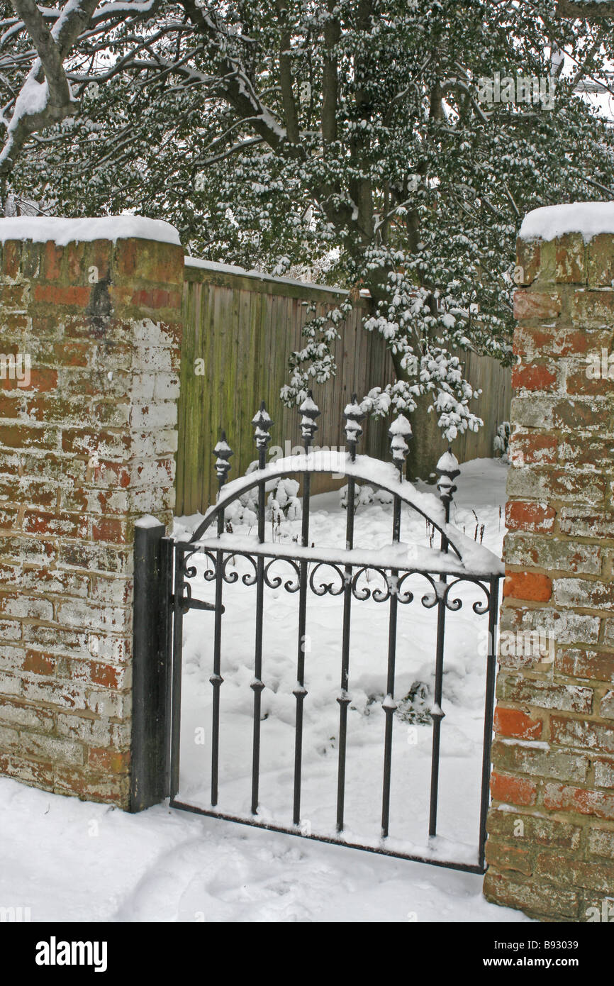 Snow on garden gate Stock Photo - Alamy