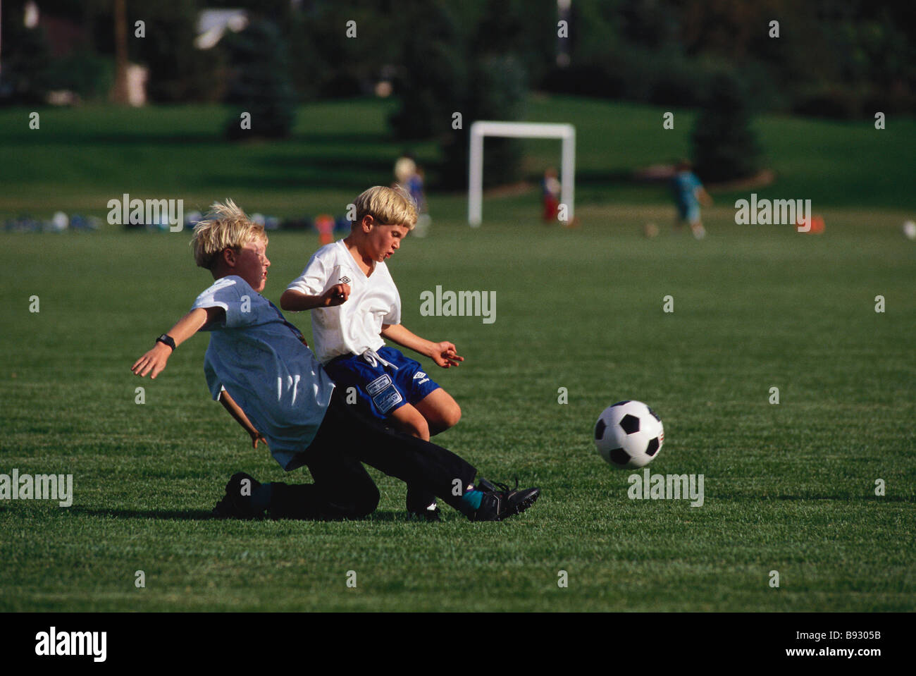 11 year old boys soccer action Stock Photo - Alamy