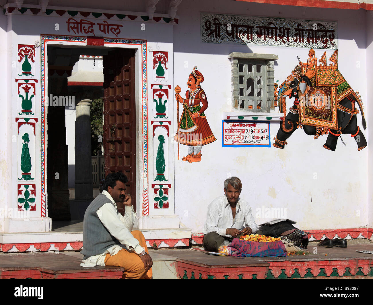 India Rajasthan Udaipur painted temple exterior people Stock Photo - Alamy