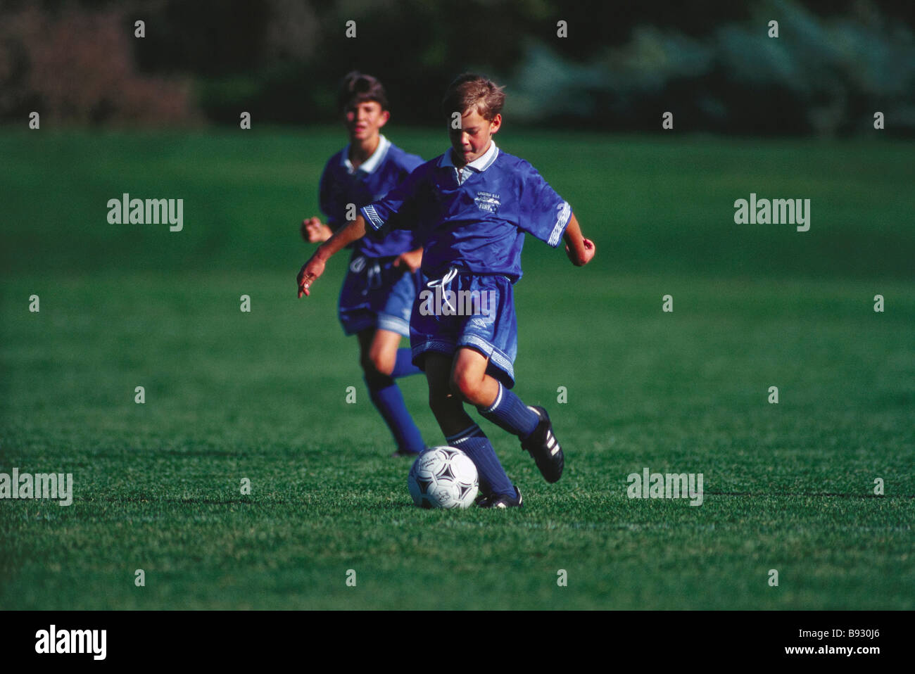 11 year old boys soccer action Stock Photo - Alamy