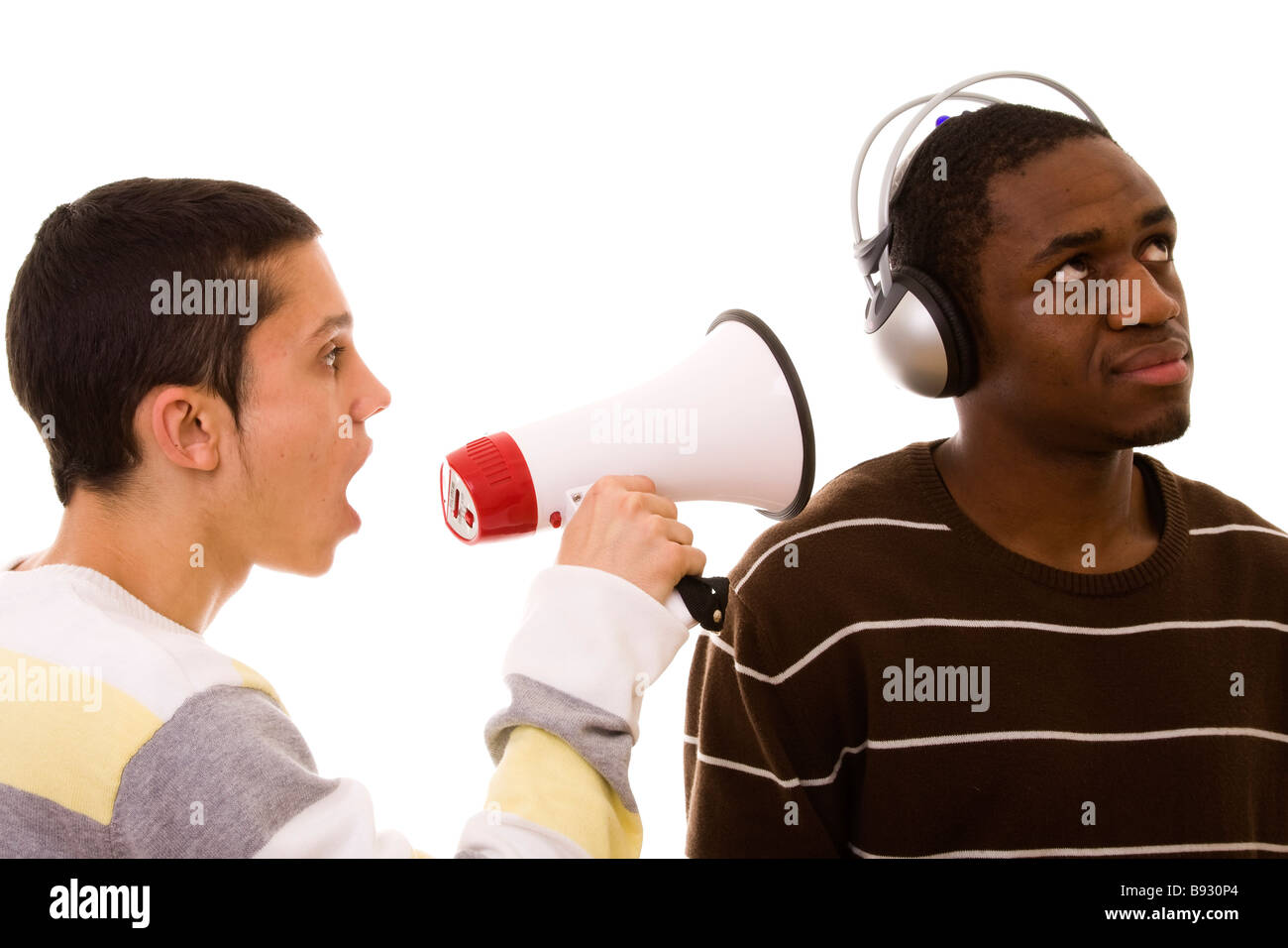 caucasian young man shouting to a african young man Stock Photo - Alamy