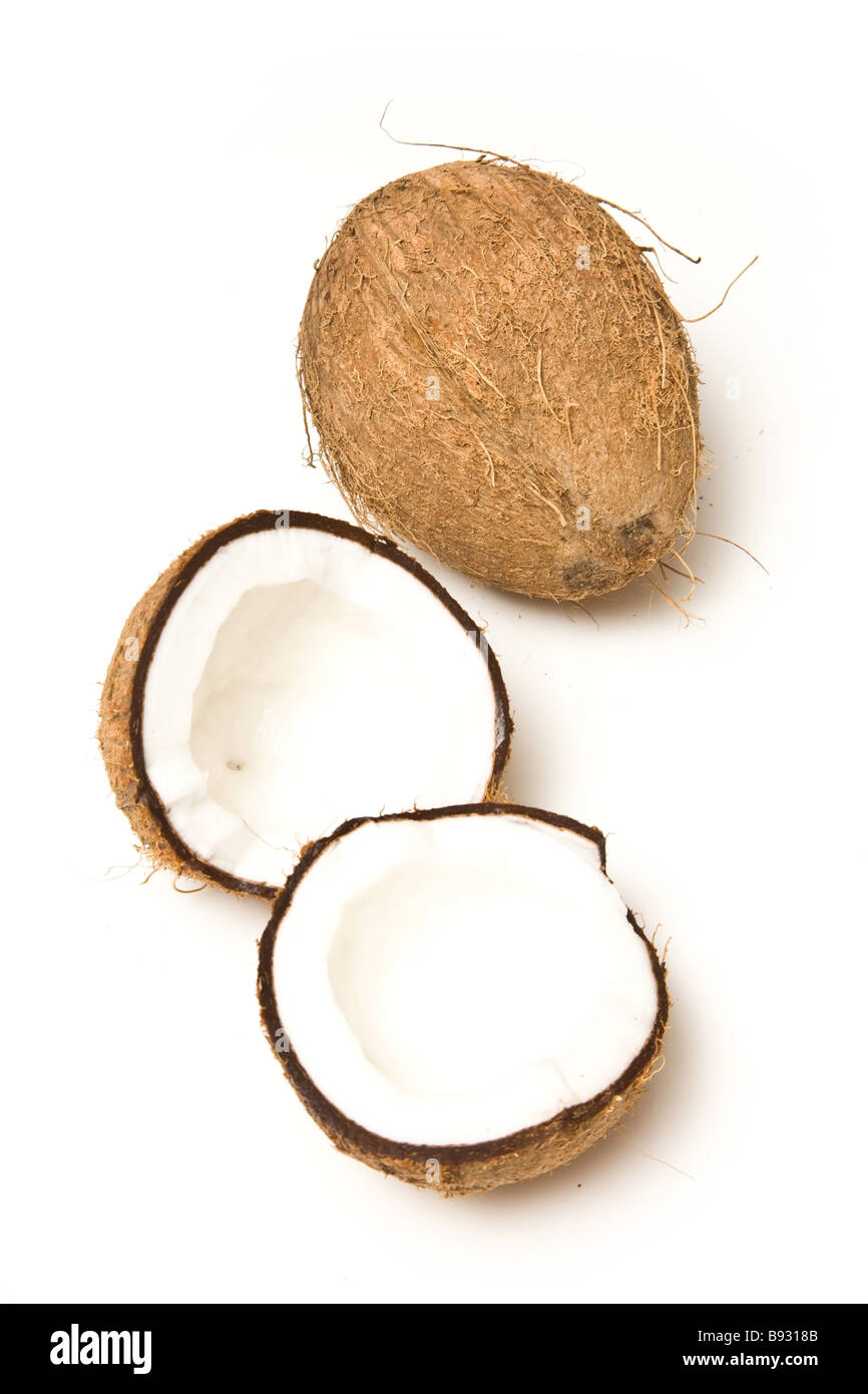Coconuts halved and whole isolated on a white studio background Stock ...