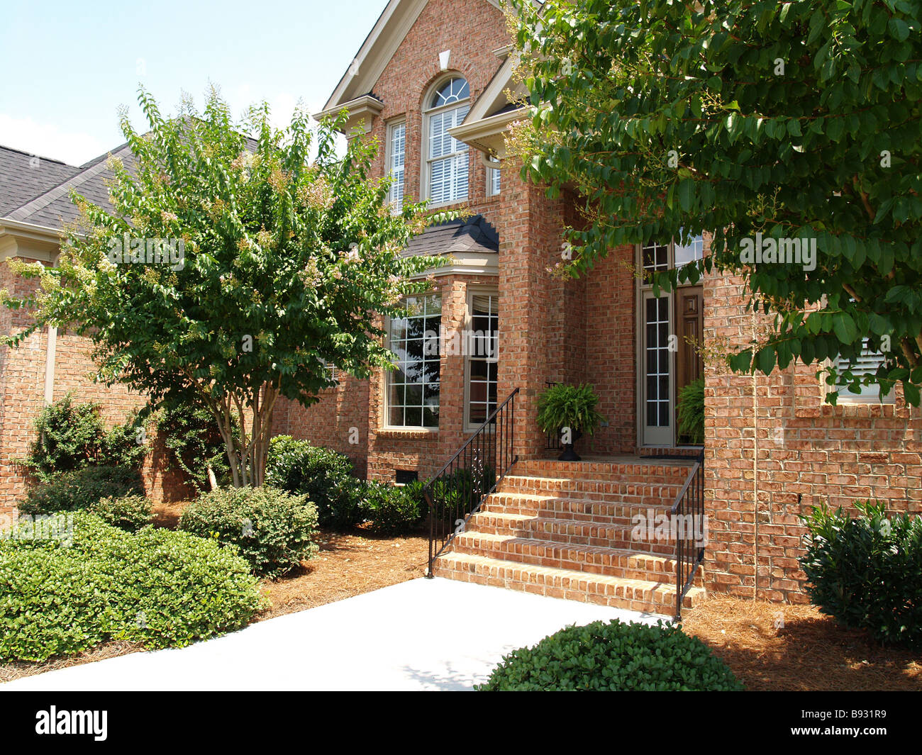 Front of a large brick home Stock Photo - Alamy