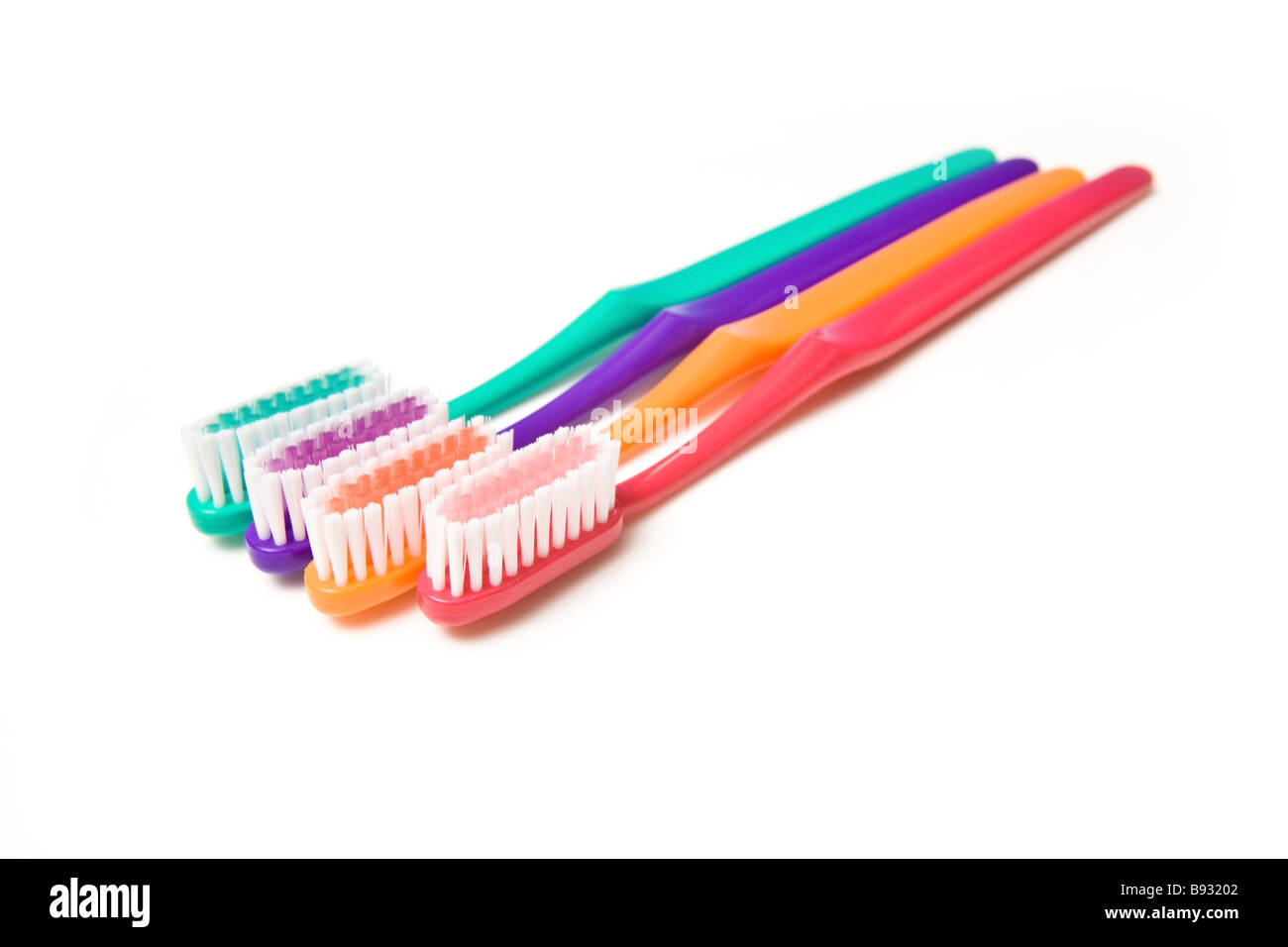 Colored toothbrushes isolated on a white studio background Stock Photo ...