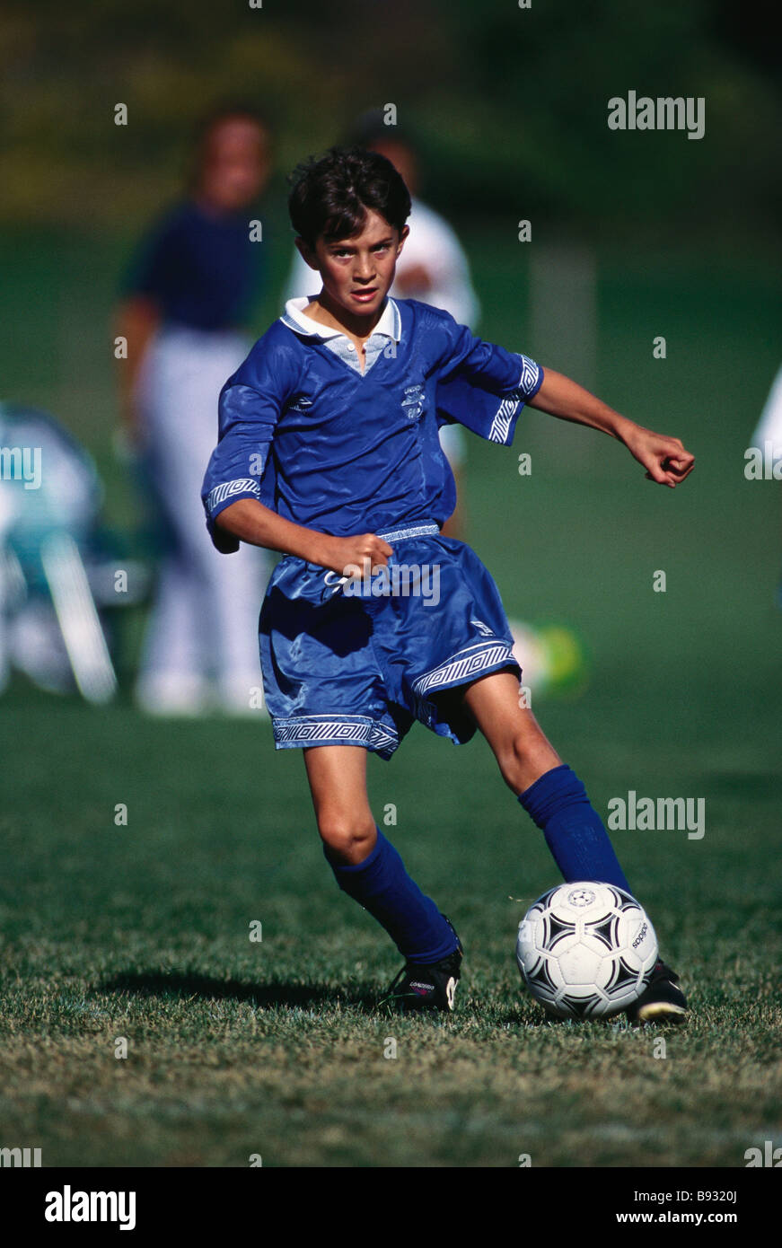 11 year old boys soccer action Stock Photo - Alamy