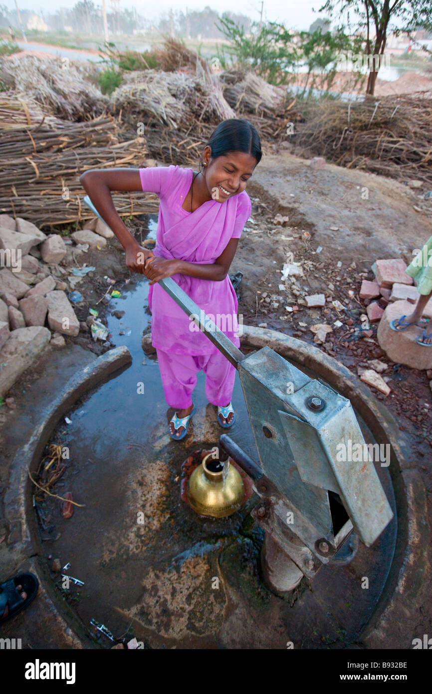 Indian Girl Pumping Water from a Well in Fatehpur Sikri India Stock ...