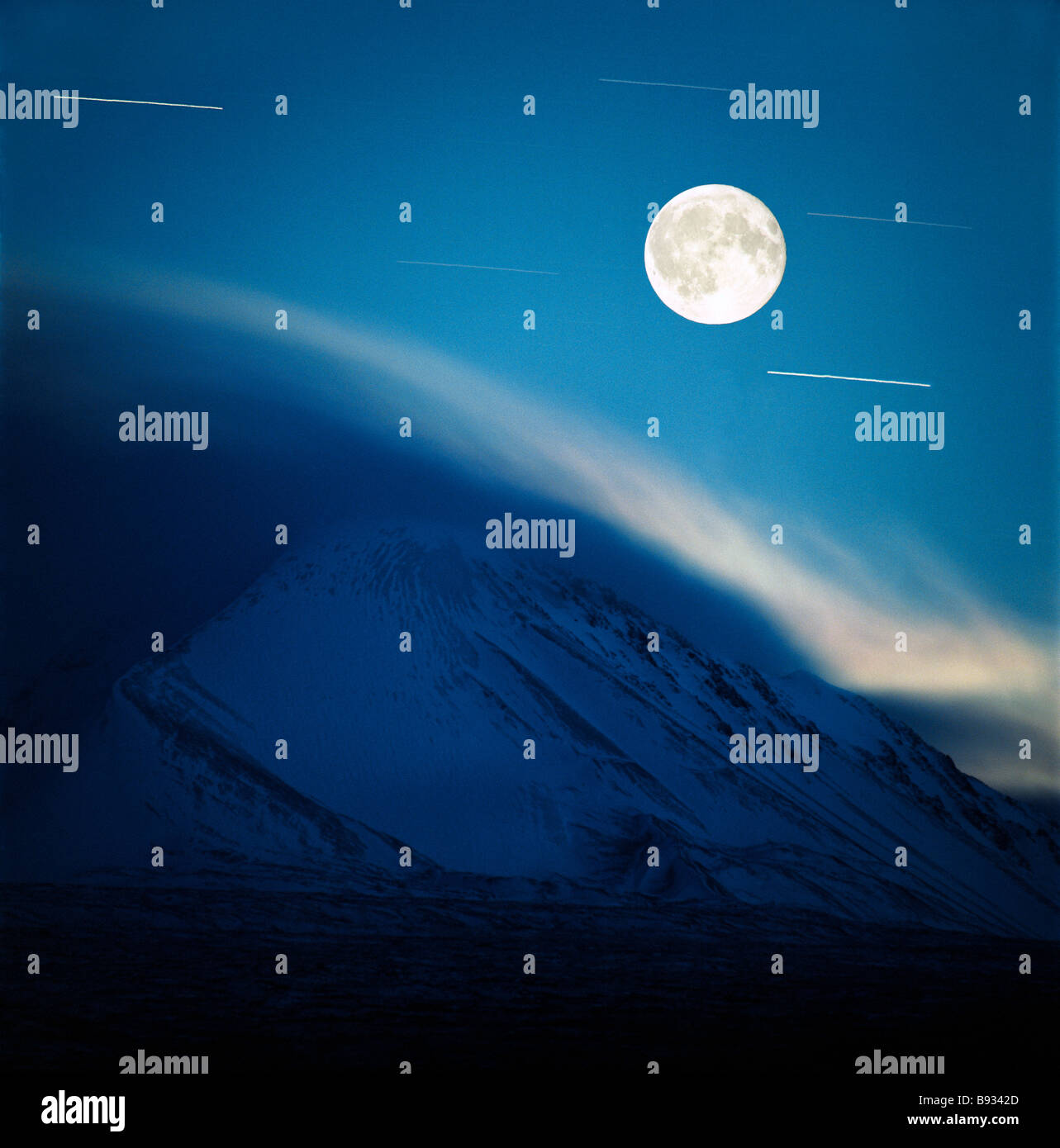Full moon over snow capped hi-res stock photography and images - Alamy