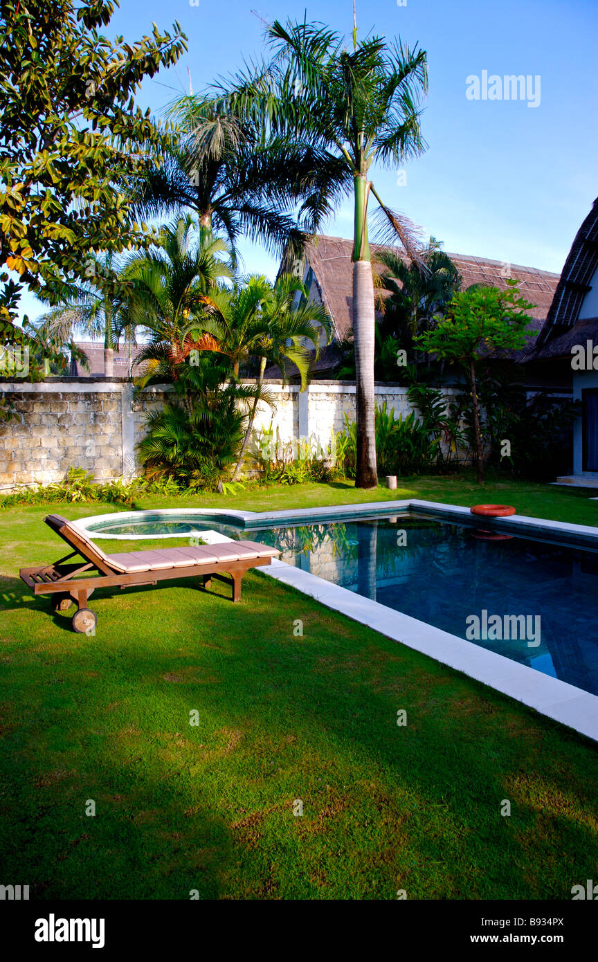 Swimming pool in front of outdoor chair Stock Photo - Alamy