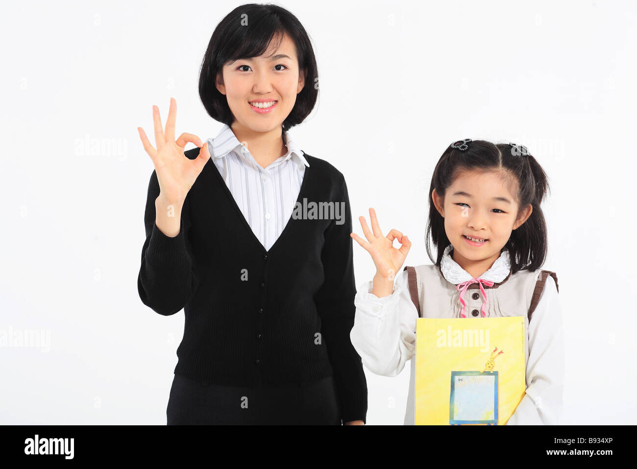 Miss Teacher and Young Girl Stock Photo - Alamy